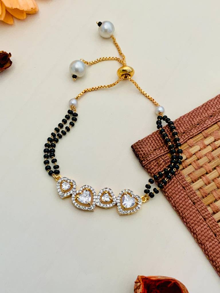 Sparkling Gold Plated Heart Hand Mangalsutra | Sparkling Gold Plated ...